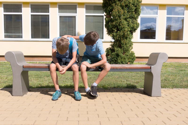 Kid Comforting Consoling Upset Sad Friend in School Yard. Problems at ...