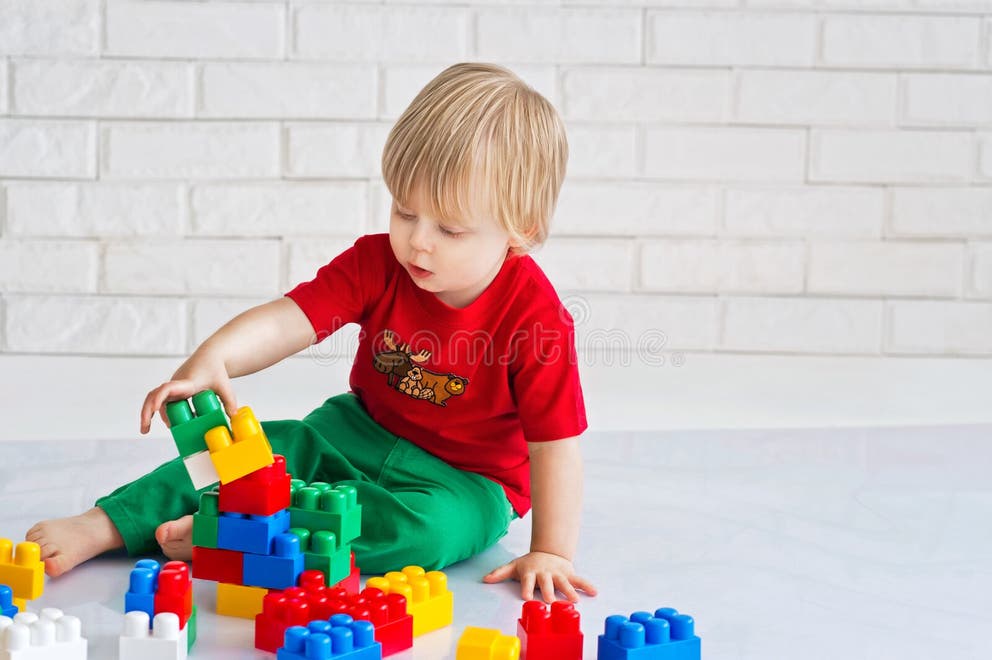 Kid and constructor blocks stock photo. Image of pretty - 31123208