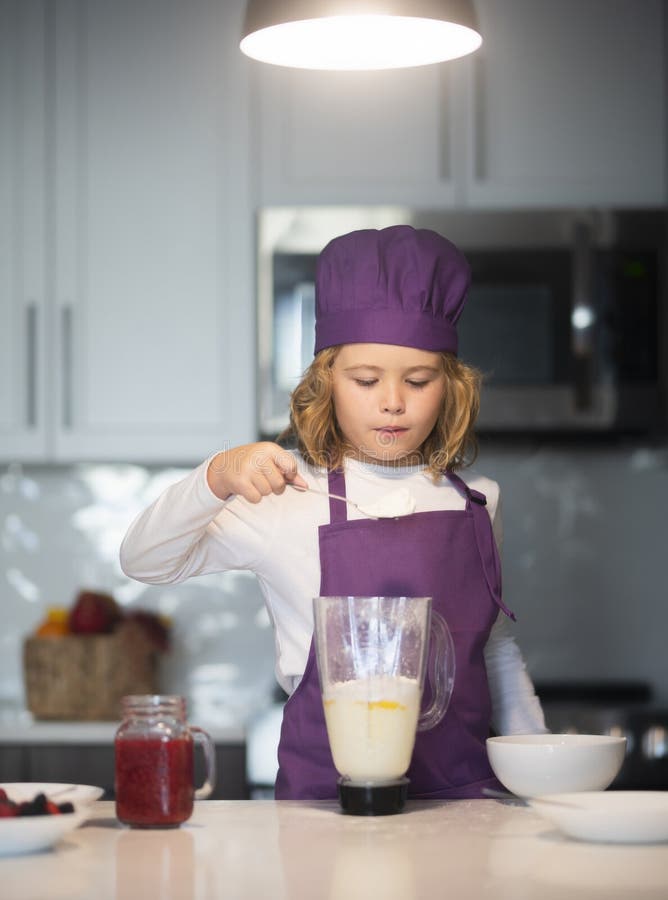 Kid Cooking. Child Chef Cook is Learning How To Make a Cake in the Home ...
