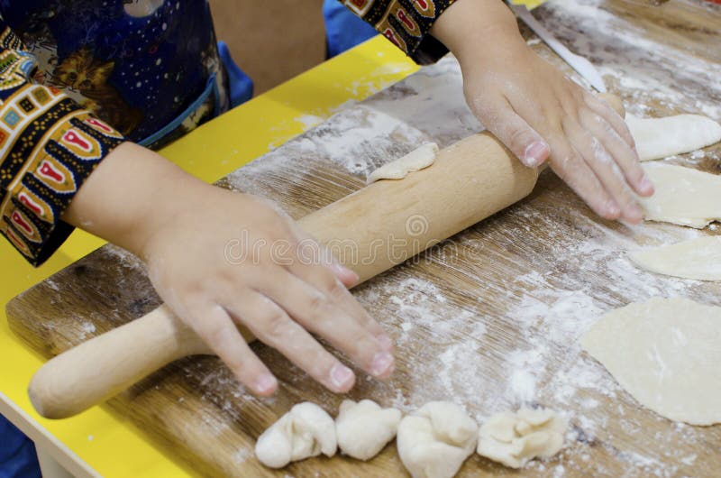 A Kid Cooking at Home by Himself. Kids Cooking Dumplings Stock Image ...