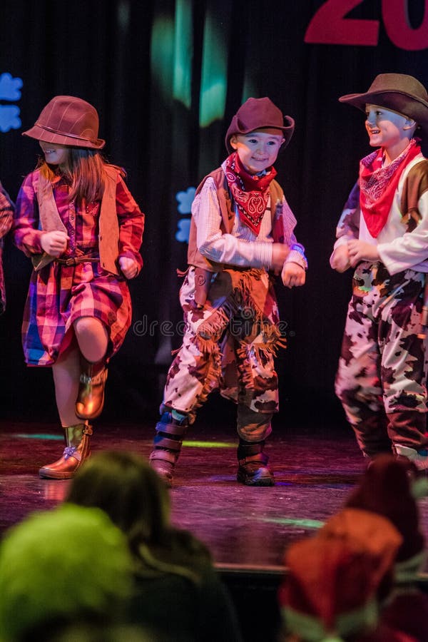 Kid Cowboy is Dancing on a Stage Editorial Photo - Image of chair ...