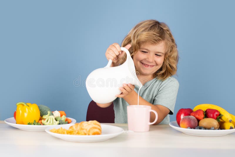 Kid with Dairy Milk. Child Having a Breakfastand Pouring Milk. Stock ...