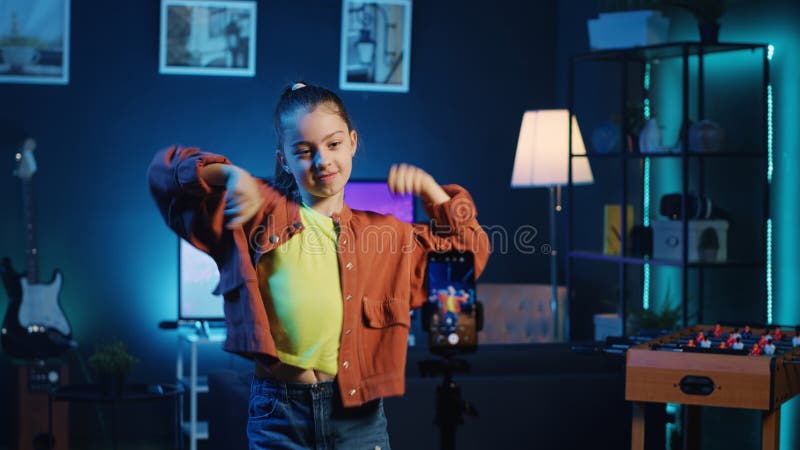 Kid Dancing in Dimly Lit Home Studio Interior, Producing Content with ...