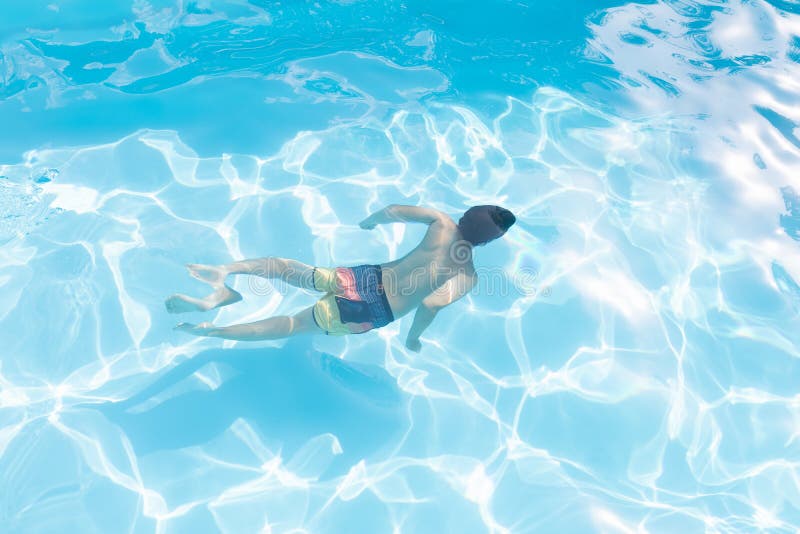 Kid Diving in a Swimming Pool Stock Image - Image of smiling, healthy ...