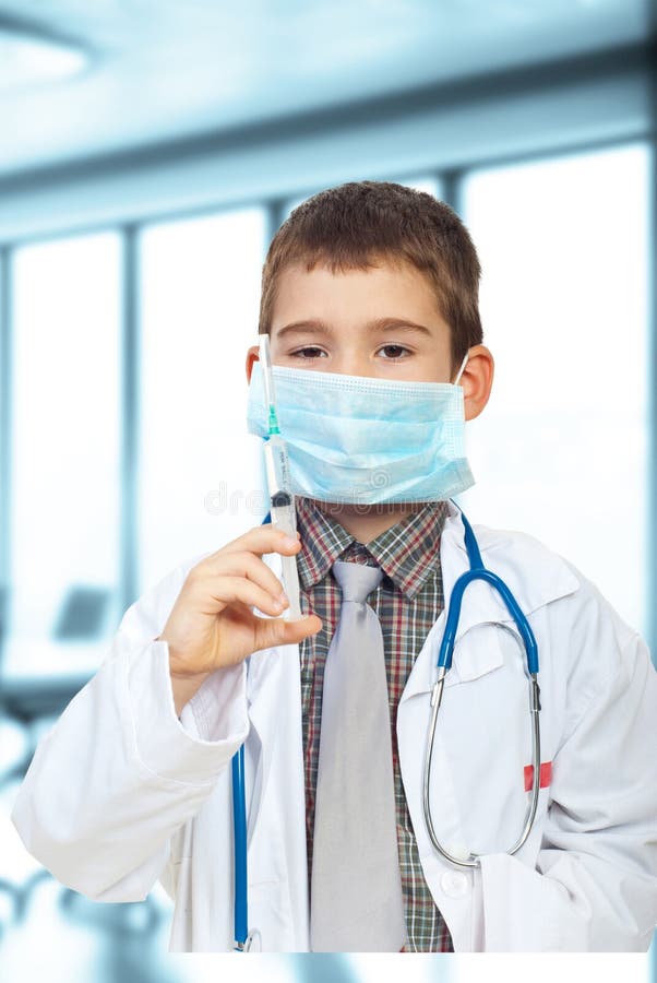 Kid Doctor with Syringe and Mask Stock Photo - Image of happiness, baby ...