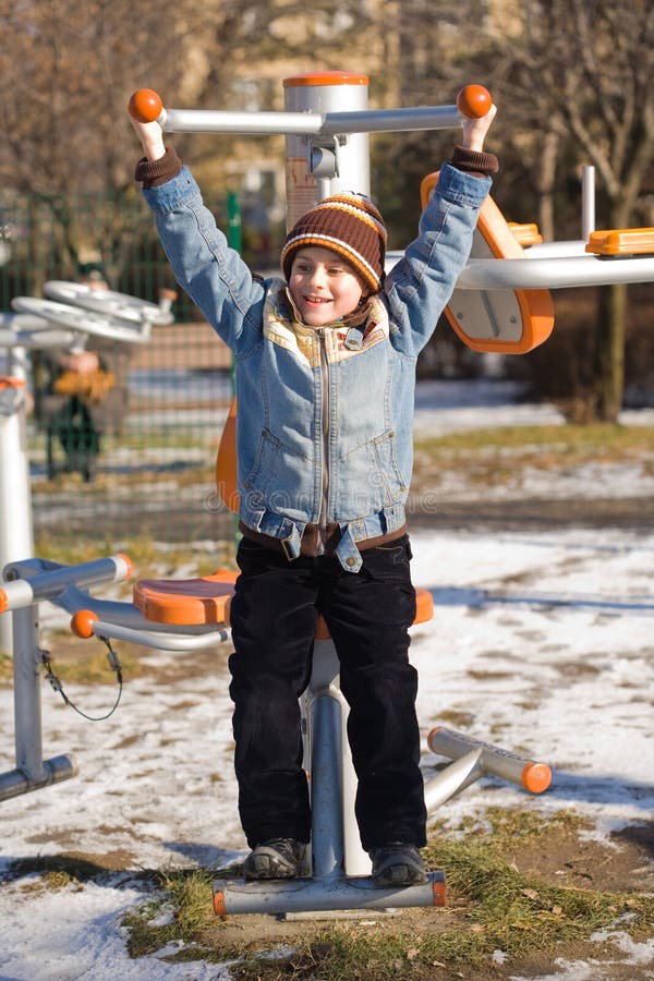 Kid doing fitness outdoor stock photo. Image of health - 7917926