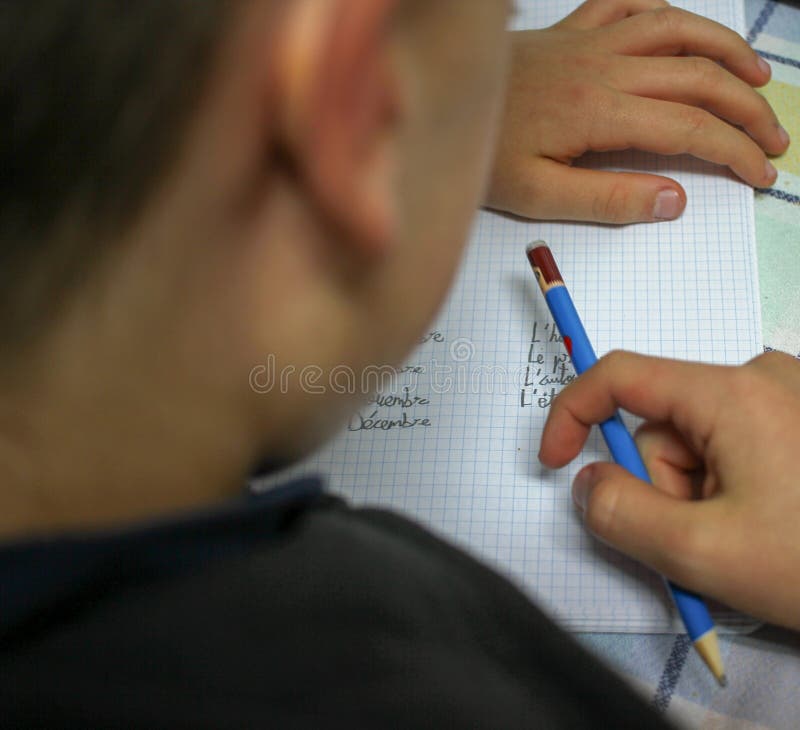 Kid doing his homework stock image. Image of creativity - 299351157