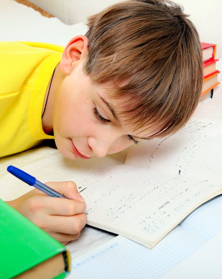 Kid doing Homework stock image. Image of childhood, glasses - 63451441