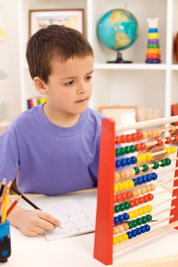 Kid doing math exercise stock image. Image of young, science - 18984023