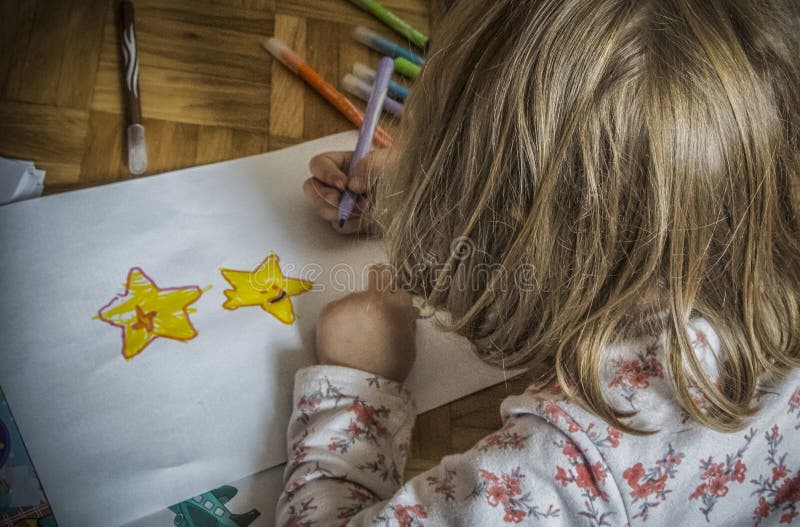 A Kid Drawing Stars stock image. Image of homework, drawing - 112202331