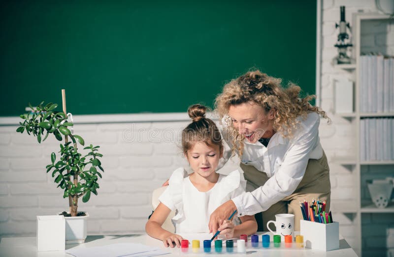 Kid Drawing with Teacher. Children from Elementary School Study at Draw ...