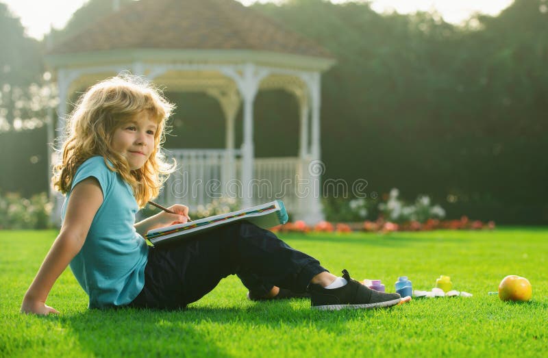 Kid Draws in Park Having Fun on Nature Background. Children Creative ...