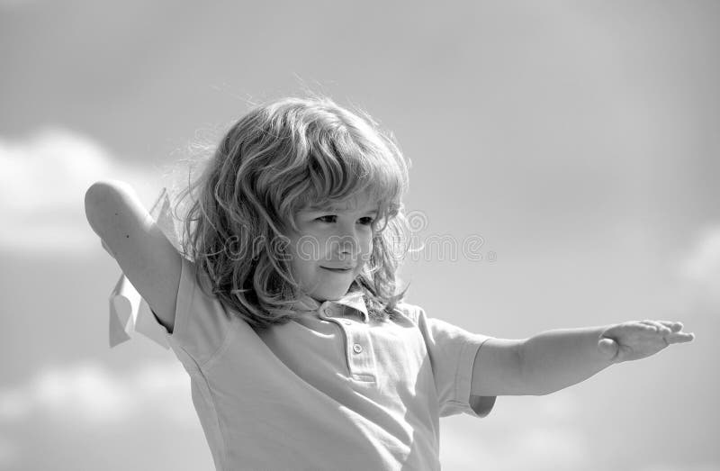 Kid Dreaming and Plays with a Toy Plane in the Park. Dreams of Travel ...