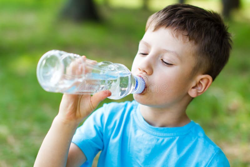 Kid drinking water stock photo. Image of refreshment - 13383826