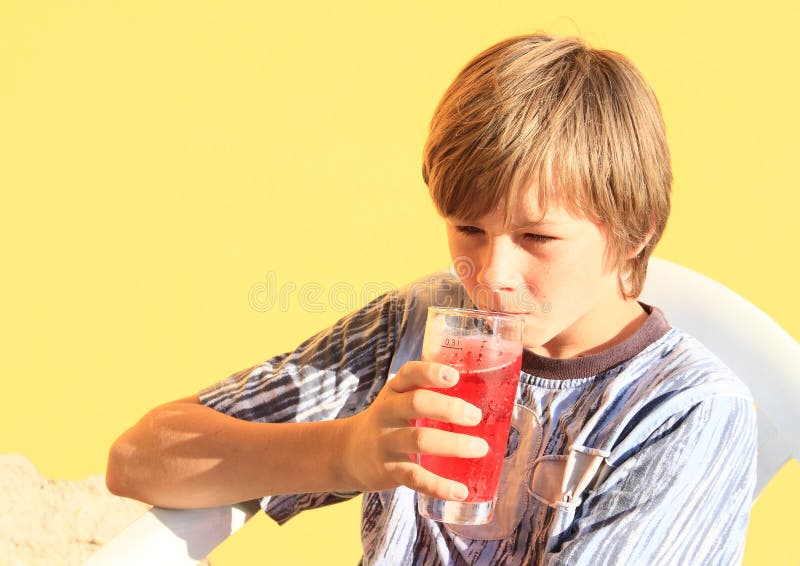 Kid drinking a drink stock image. Image of holding, restaurant - 42655341