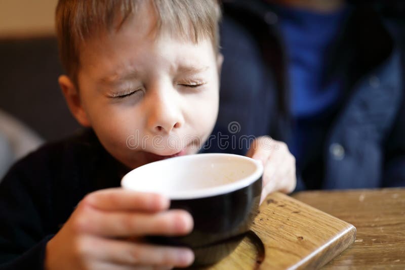 Kid drinking tea stock photo. Image of male, face, organic - 165376696