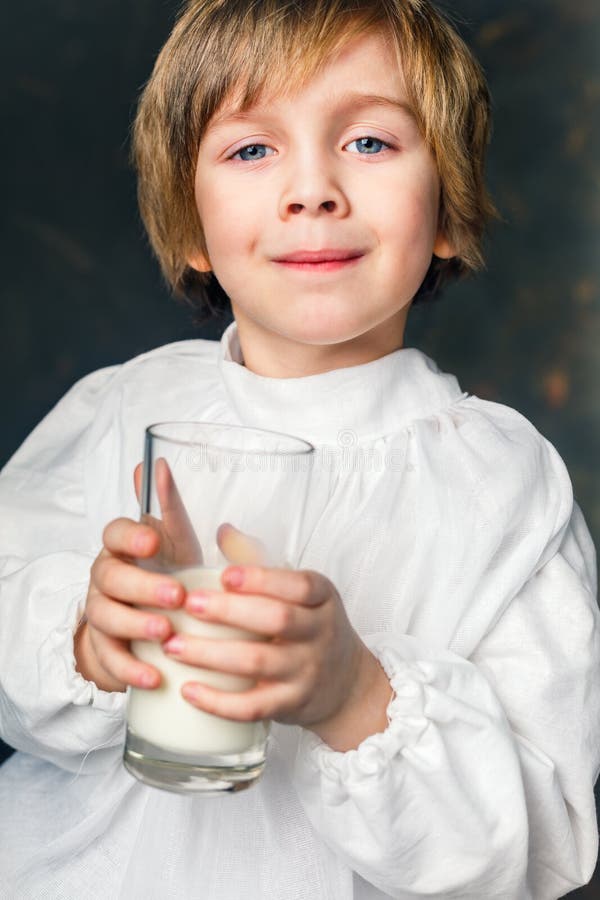Kid drinks a glass of milk stock image. Image of childhood - 52588125