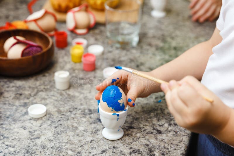 Kid Easter Preparation by Painting Easter Eggs and Holiday Decorations ...