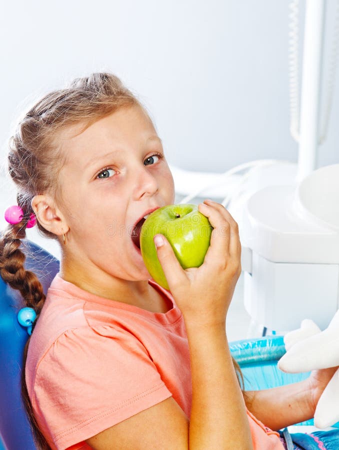 Kid eating an apple stock image. Image of cure, holding - 25894783