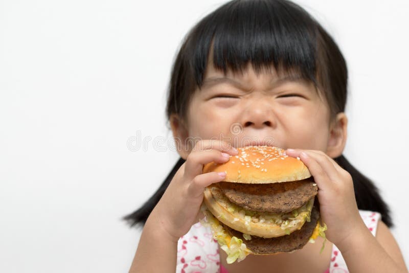 Kid eating big burger stock image. Image of humorous - 38024263