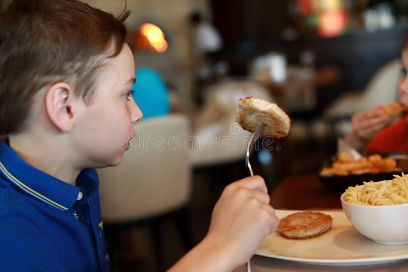 Kid Eating Cutlet. with Macaroni Stock Image - Image of face, healthy ...