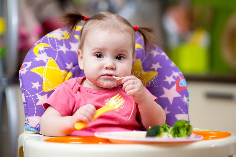 Kid eating food on kitchen stock image. Image of healthy - 50569669