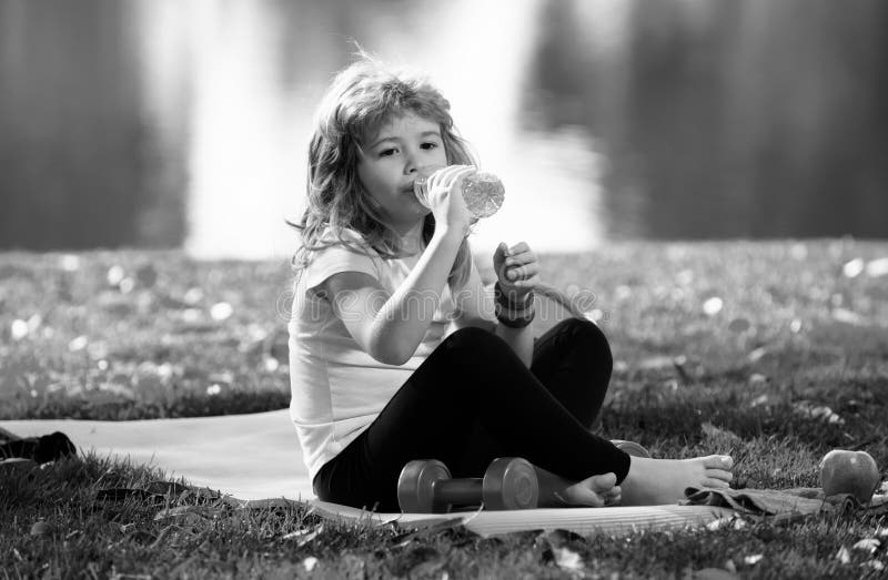 Kid Eating Healthy Food, Drinking Water after Exercise. Stock Image ...