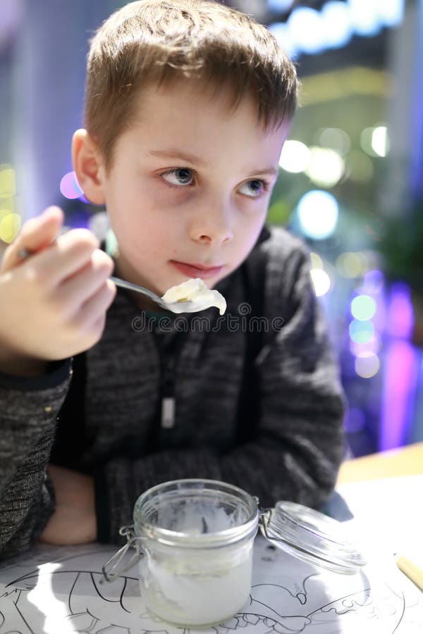 Kid eating ice cream stock image. Image of face, caucasian - 242927147