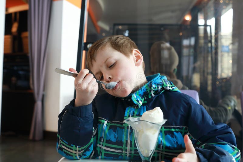 Kid eating ice-cream stock photo. Image of face, cream - 5045964