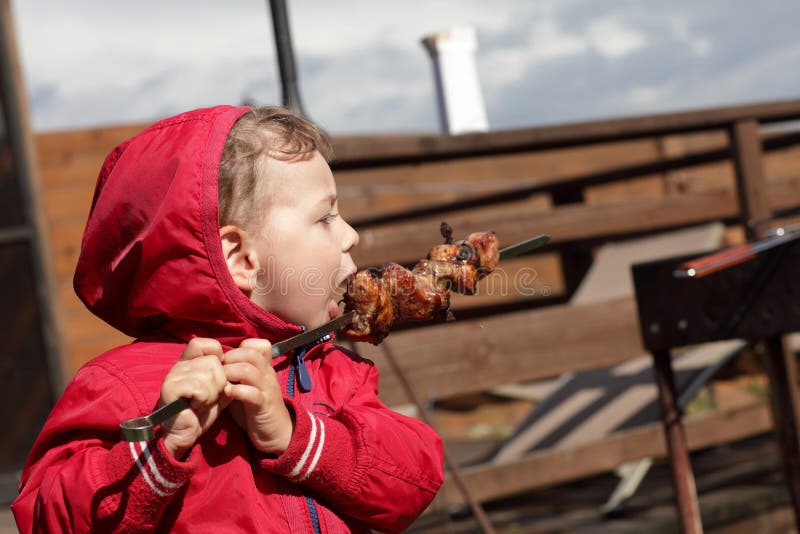 Child Eating Meat on a Skewer Stock Image - Image of caucasian, grilled ...