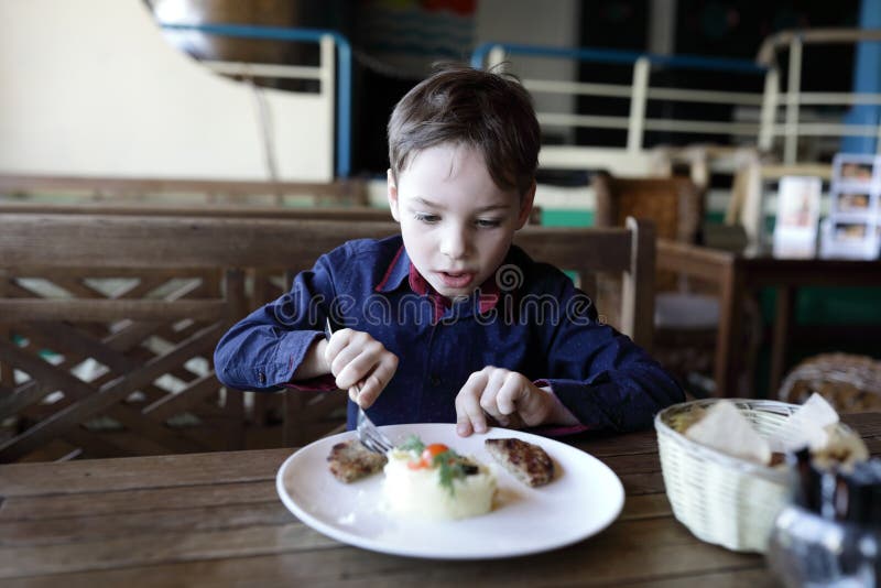 Kid eating mashed potatoes stock photo. Image of appetite - 113489674