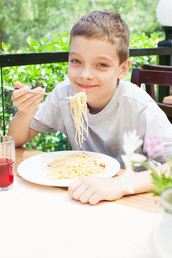 Kid eating pasta stock photo. Image of lifestyle, childhood - 37116946