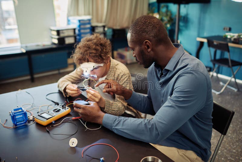 Kid in Engineering Class with Teacher Stock Photo - Image of ...