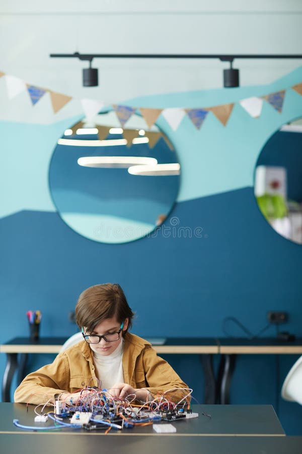 Kid in Engineering Class stock photo. Image of robot - 215182032