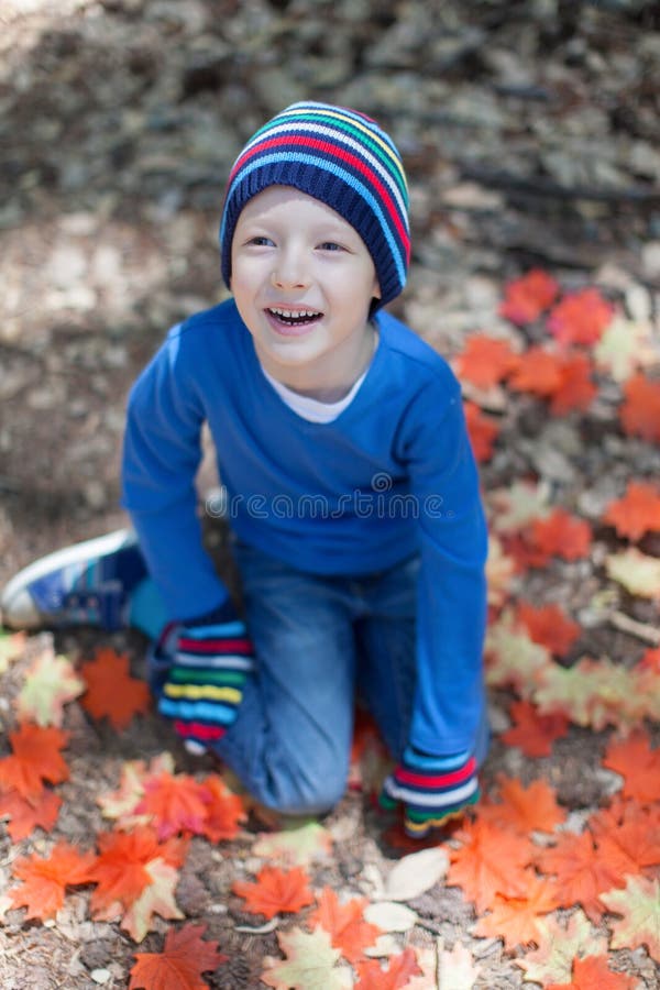 Kid at fall stock image. Image of autumn, gloves, forest - 44138843