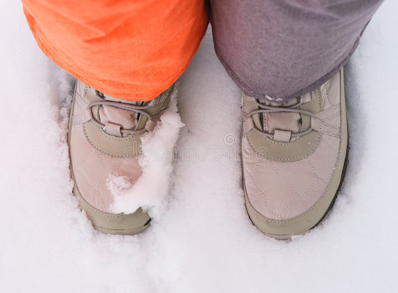 Kid Feet in Winter Shoes Standing on the Snow Stock Image - Image of ...
