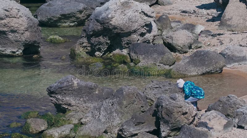 Fisher in a Rocks Beach at Sunset Stock Footage - Video of fishing ...