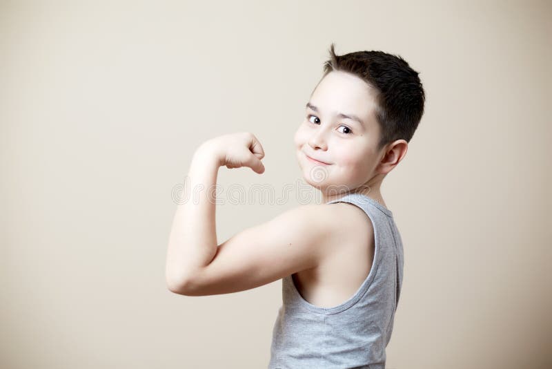 Kid flexing biceps stock image. Image of muscle, emotionally - 70204467