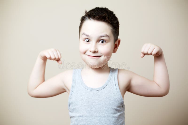 Kid flexing biceps stock photo. Image of childhood, people - 70204474