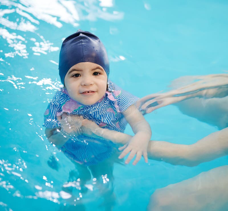 Kid float in pool water stock photo. Image of child - 213811498