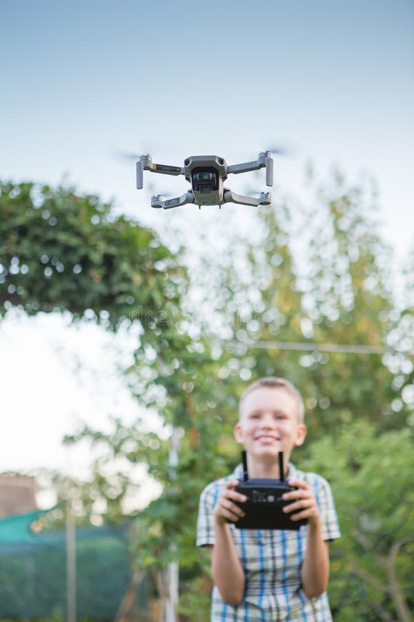 Kid Flying Drone. Boy Operate Drones Stock Image - Image of outdoor ...