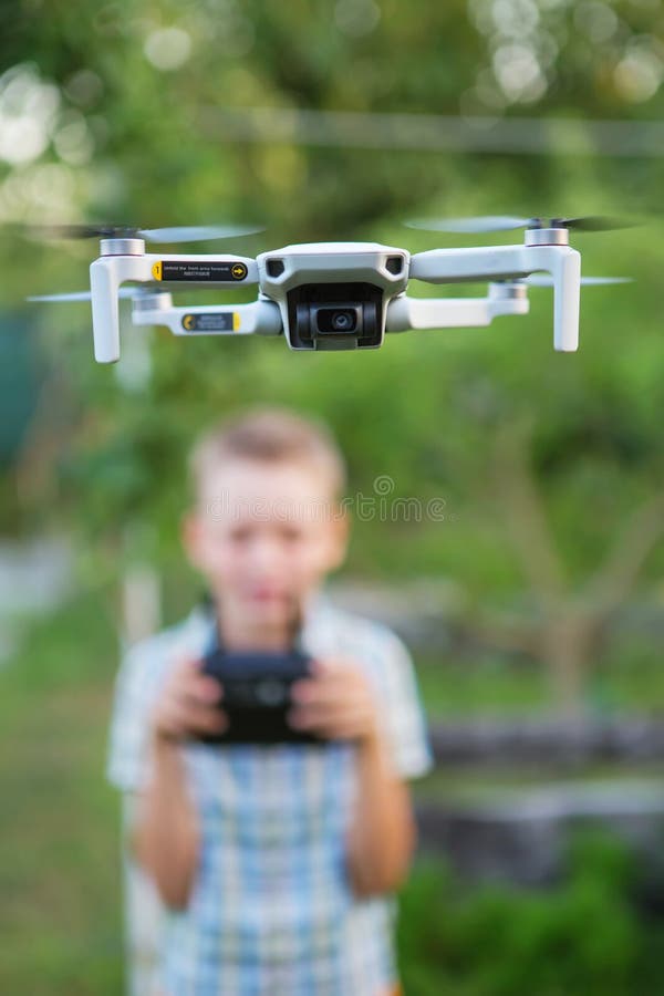 Kid Flying Drone. Boy Operate Drones. Child Operating Quadcopter Stock ...