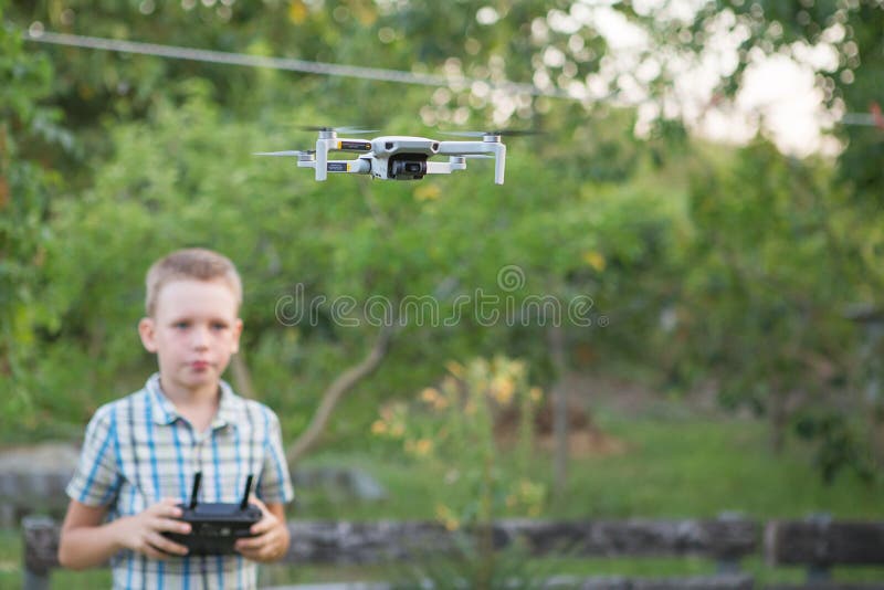 Kid Flying Drone. Boy Operate Drones Stock Image - Image of modern ...