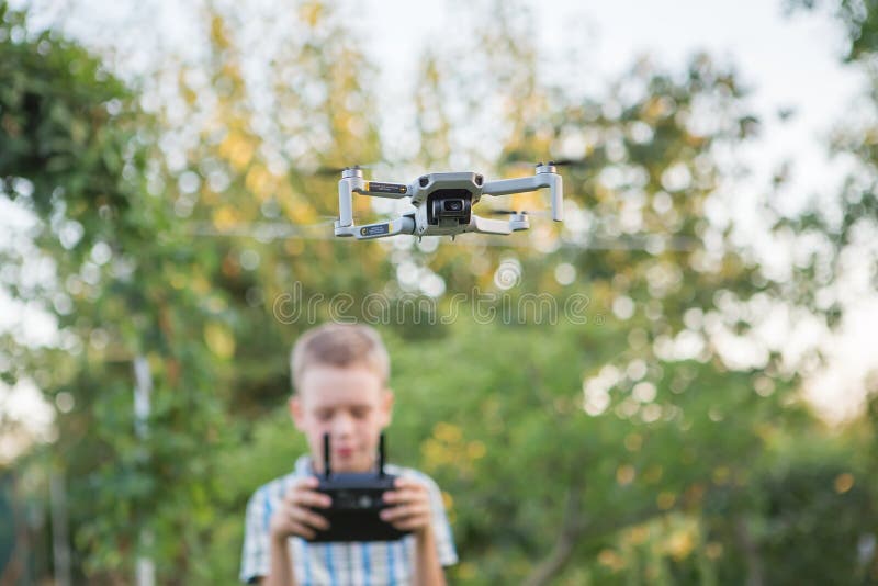 Kid Flying Drone. Boy Operate Drones Stock Image - Image of electronics ...