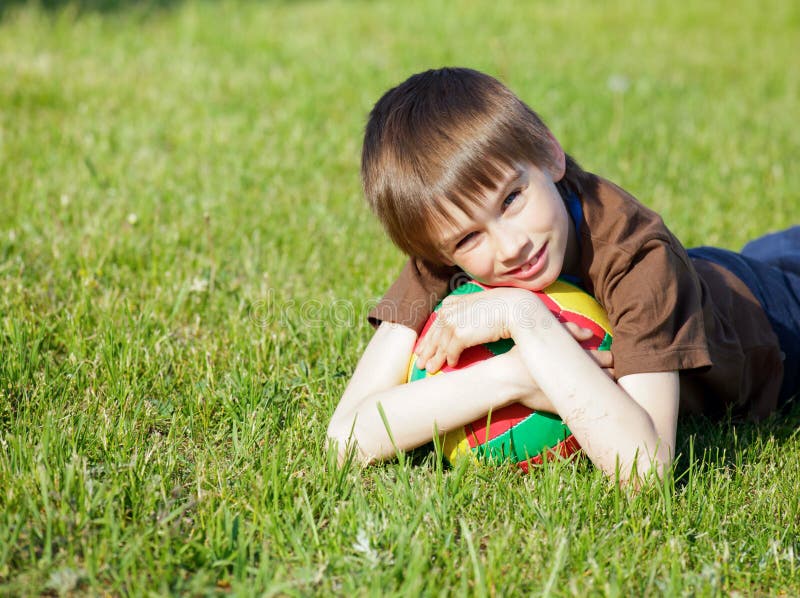 Kid with football stock photo. Image of grass, child - 19761414