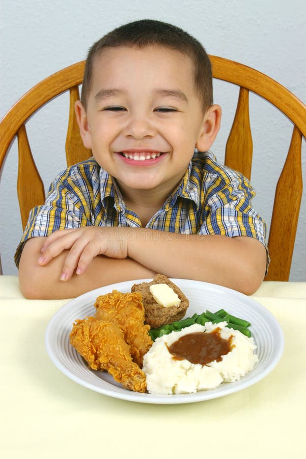Boy eating fried chicken stock photo. Image of gravy, mouth - 2514418
