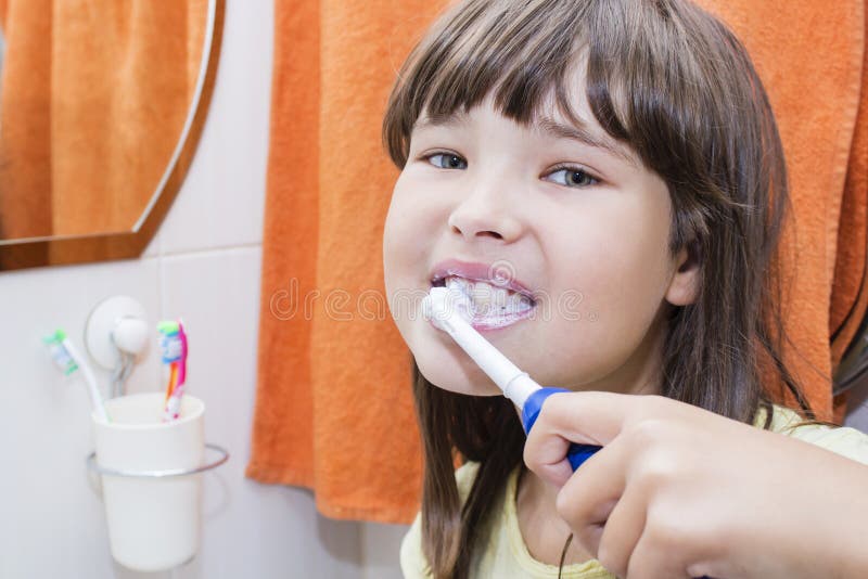 A Kid Girl Brushing Her Teeth on a Bath Room Stock Photo - Image of ...