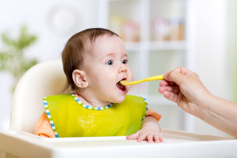 Kid Girl Eating with Spoon Indoors Stock Image - Image of hungry, chair ...