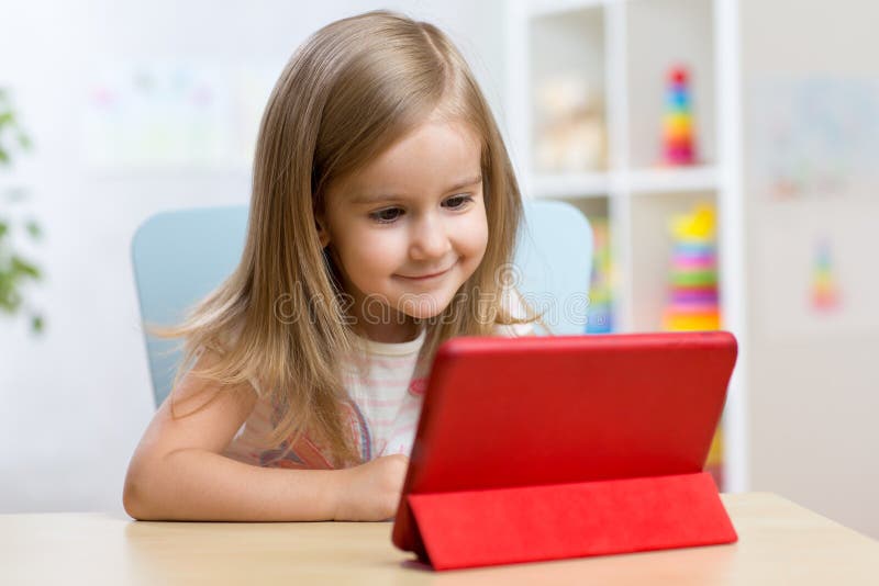 Kid Girl Playing with Tablet Computer at Home Stock Image - Image of ...
