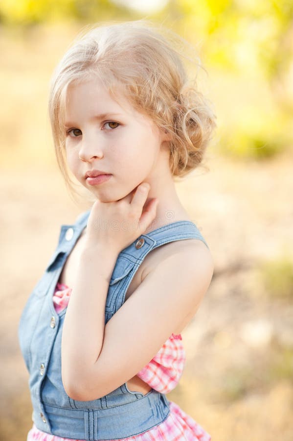 Cute Smiling Girl Posing on Blue Background Stock Image - Image of ...